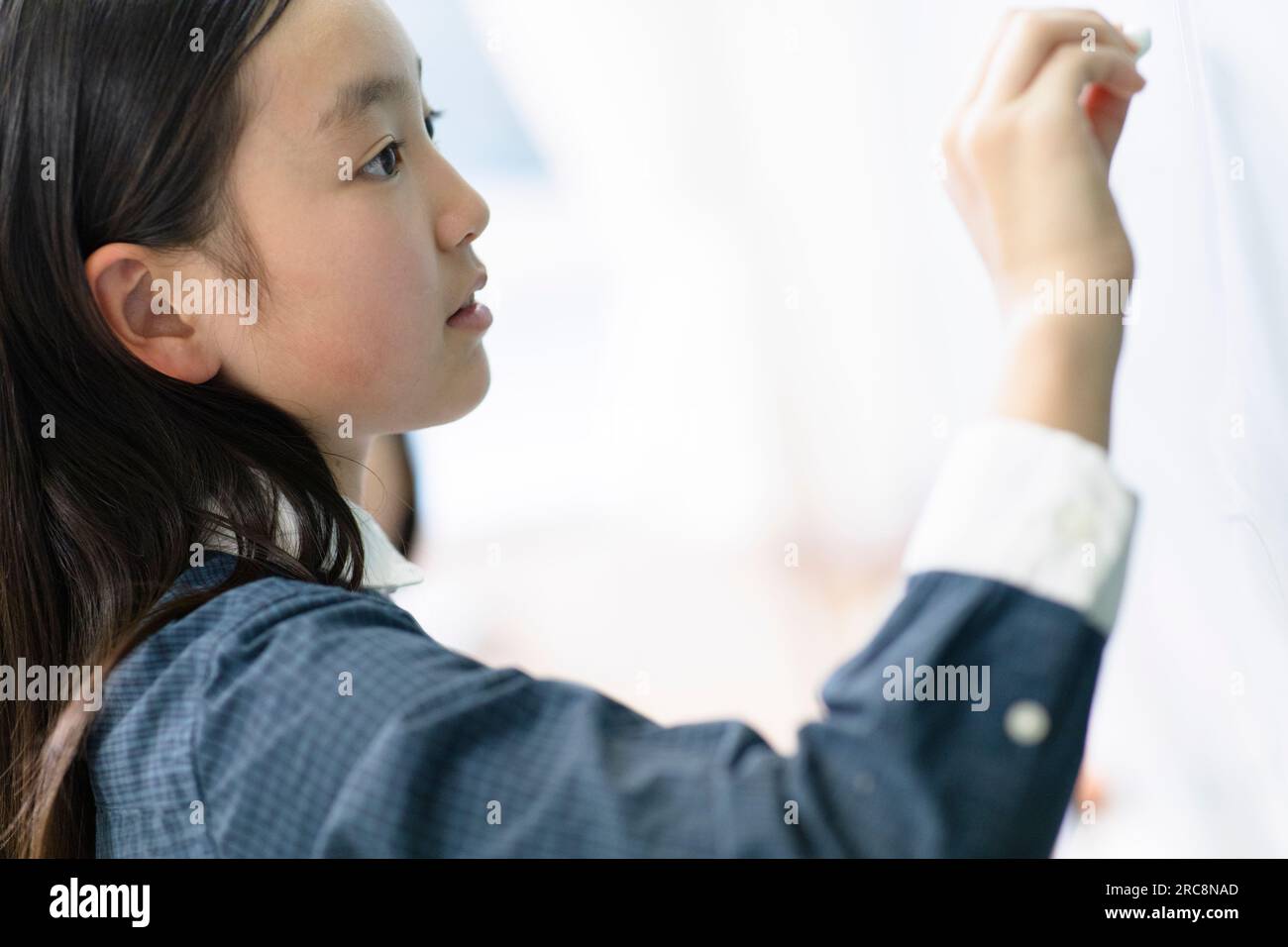 Elementary school students solving problems on the blackboard Stock ...