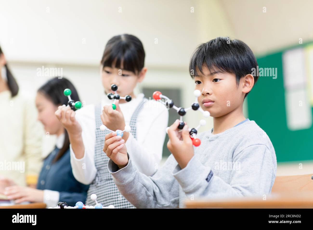 Elementary school students assembling a model in the classroom Stock ...