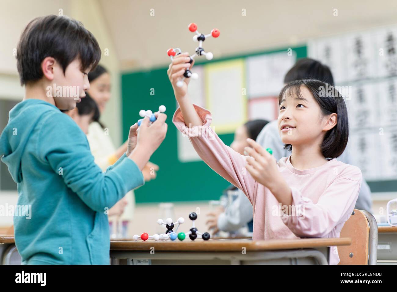 Elementary school students assembling a model in the classroom Stock ...