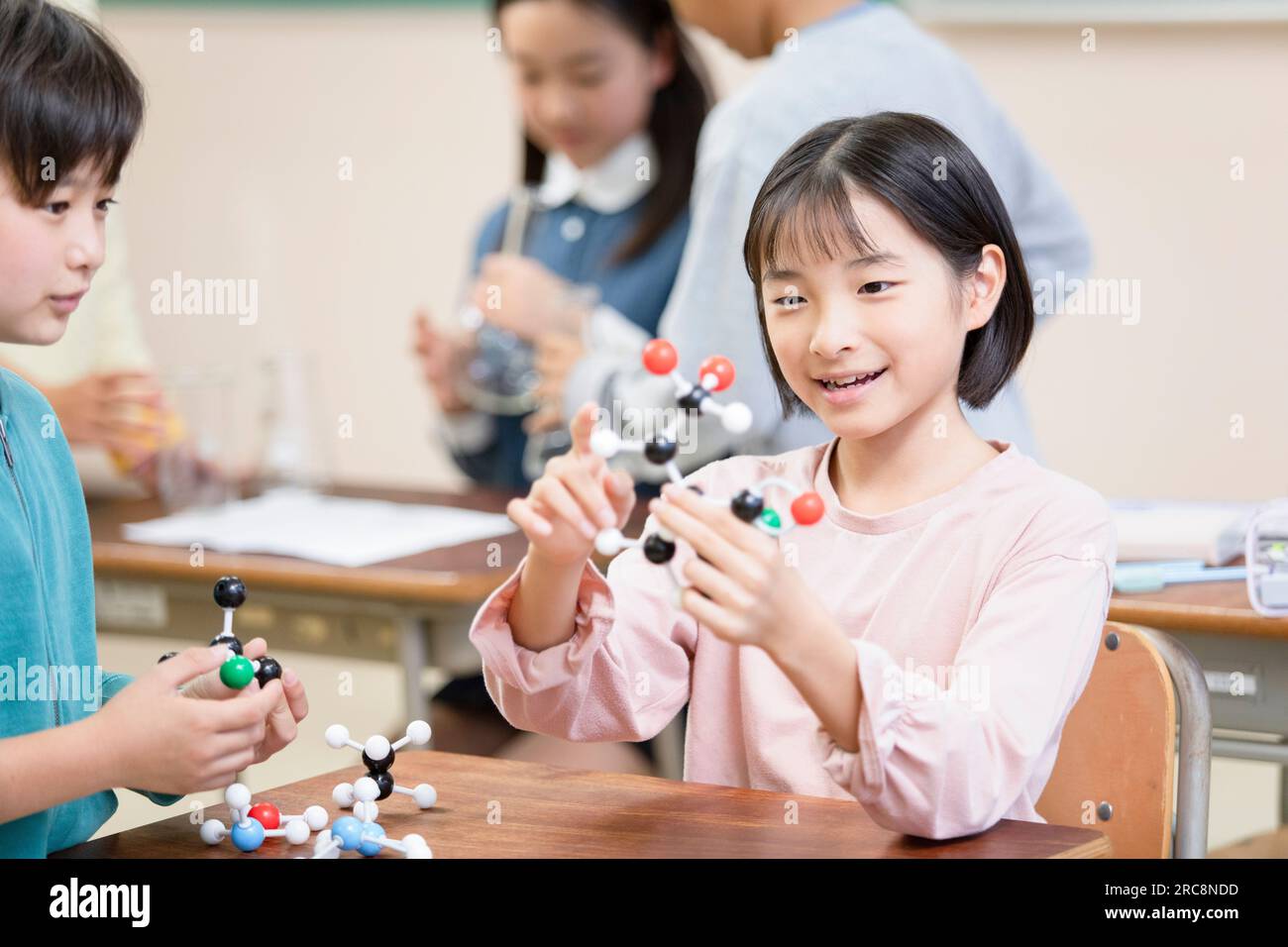 Elementary school students assembling a model in the classroom Stock ...