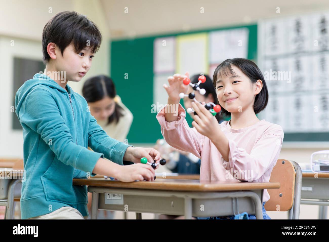 Elementary school students assembling a model in the classroom Stock ...