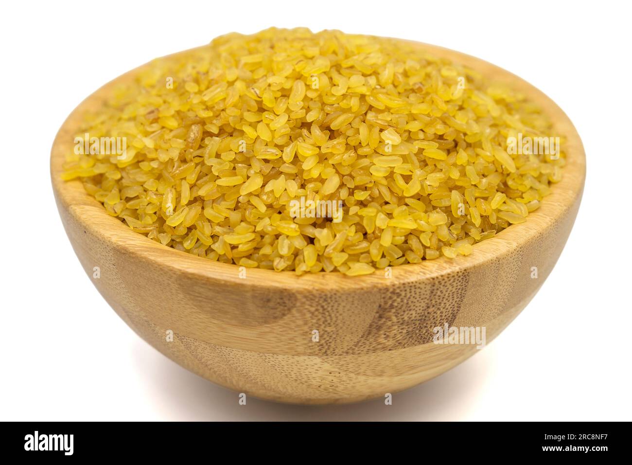 Raw bulgur wheat isolated on white background. Uncooked dried bulgur in ...