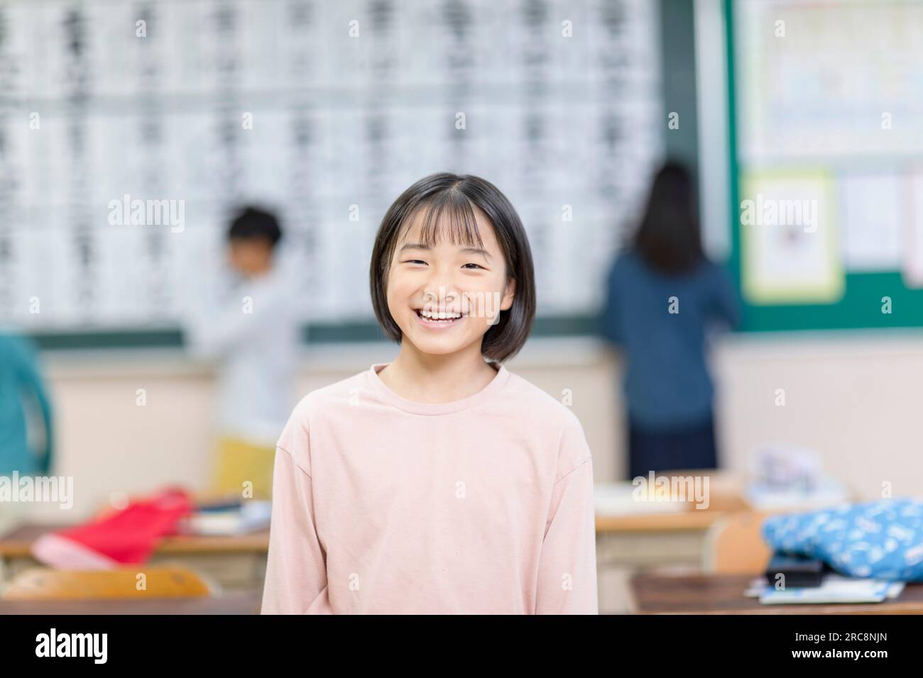 Smiling girl in the classroom Stock Photo - Alamy