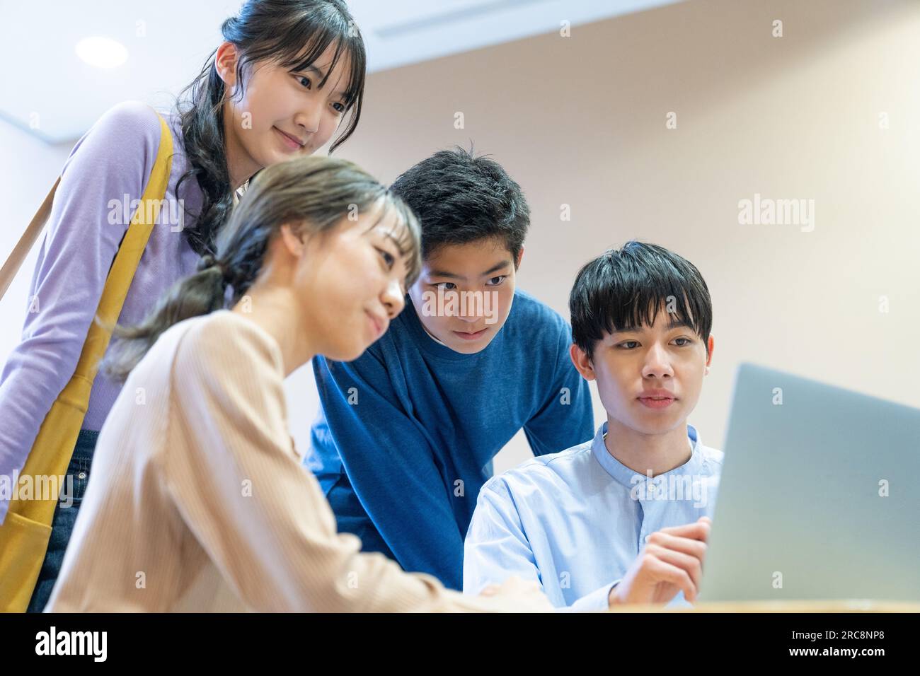College boy looking laptop hi-res stock photography and images - Alamy