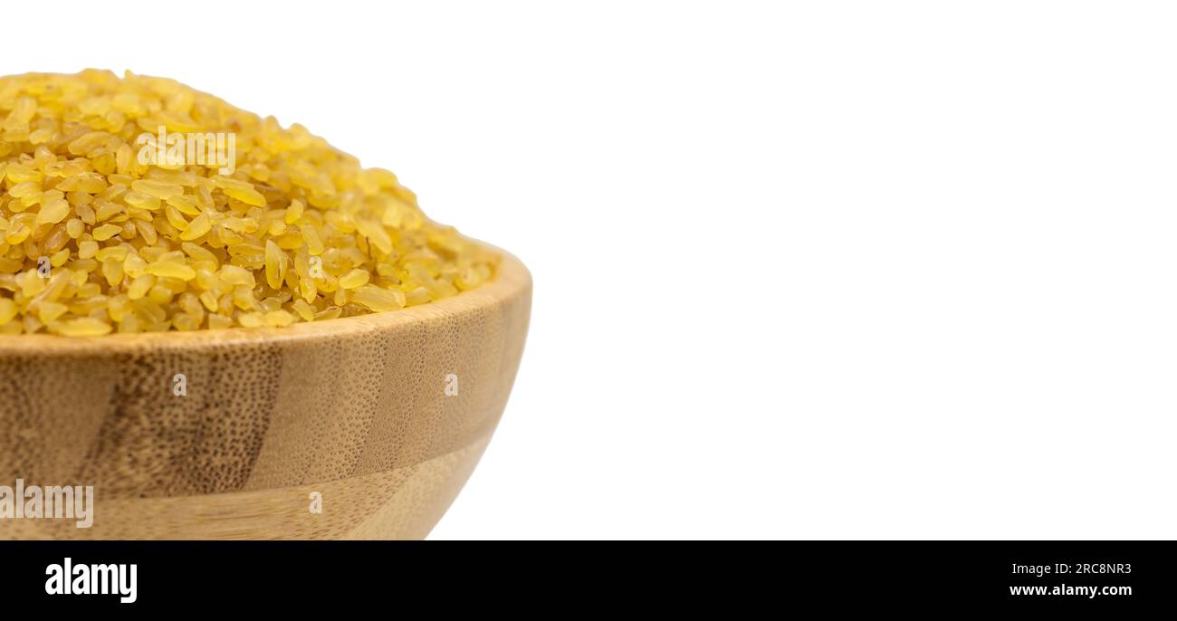 Raw bulgur wheat isolated on white background. Uncooked dried bulgur in ...