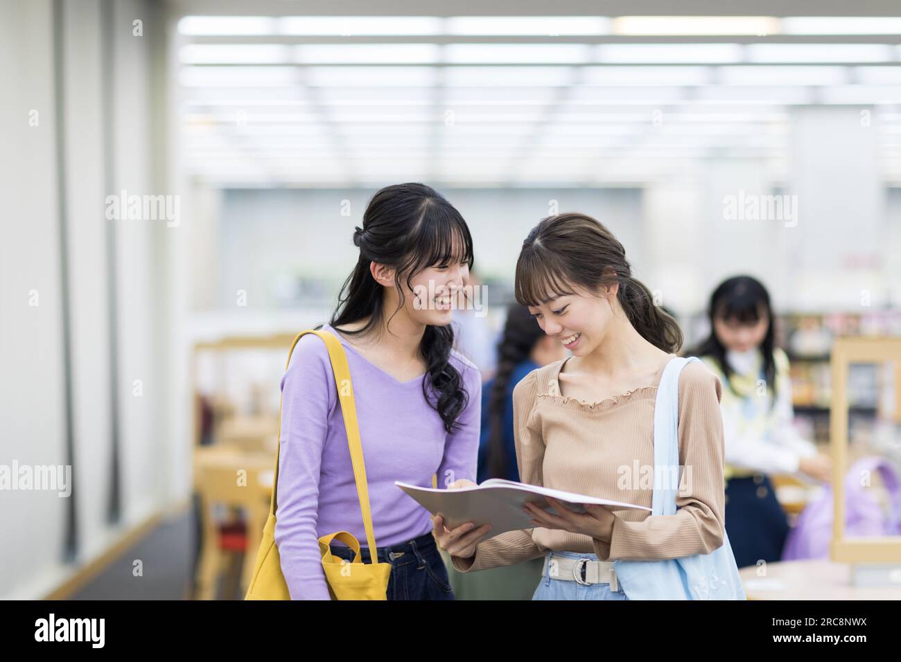 College student looking at notebook Stock Photo - Alamy