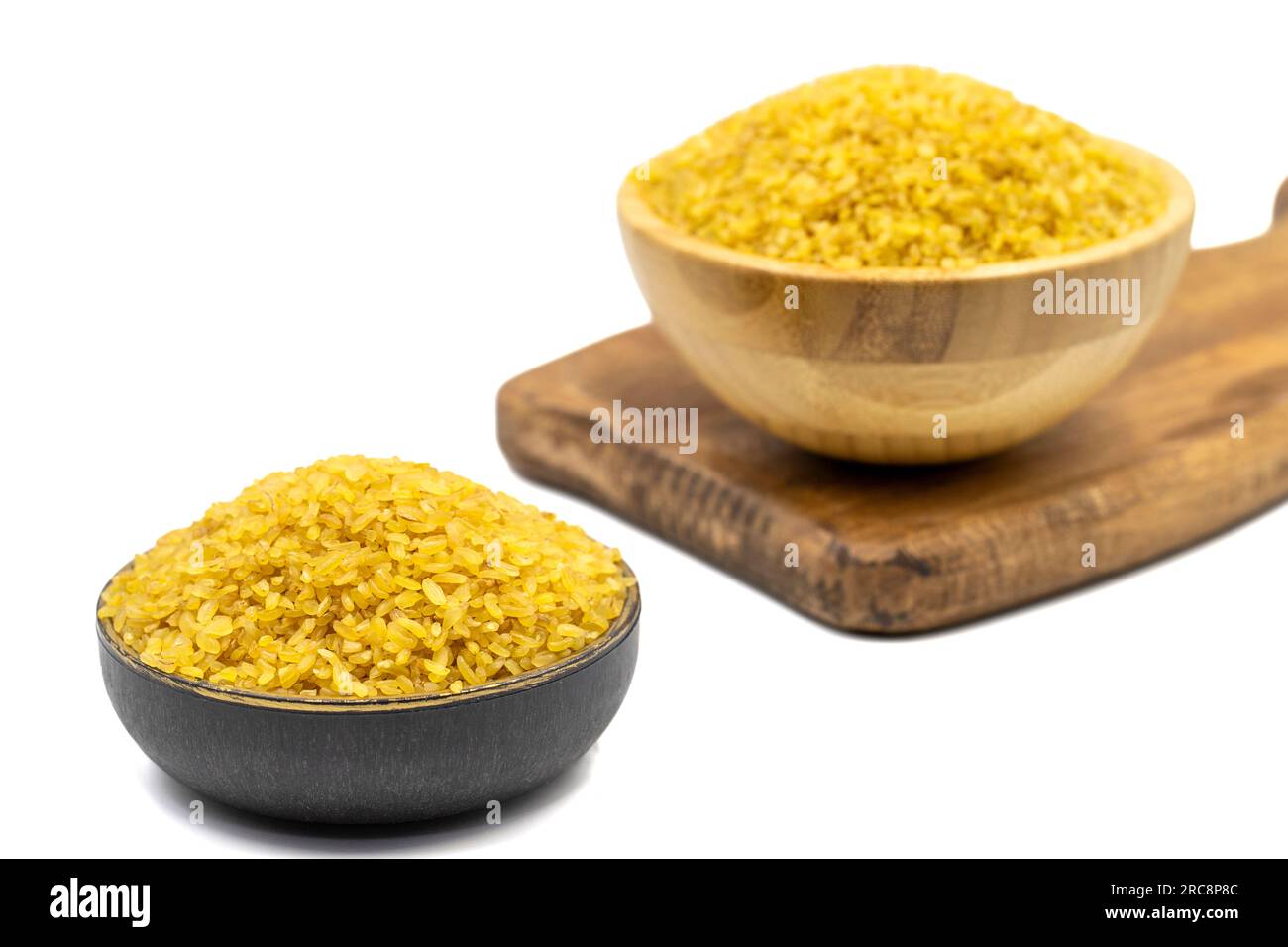 Raw bulgur wheat isolated on white background. Uncooked dried bulgur in ...
