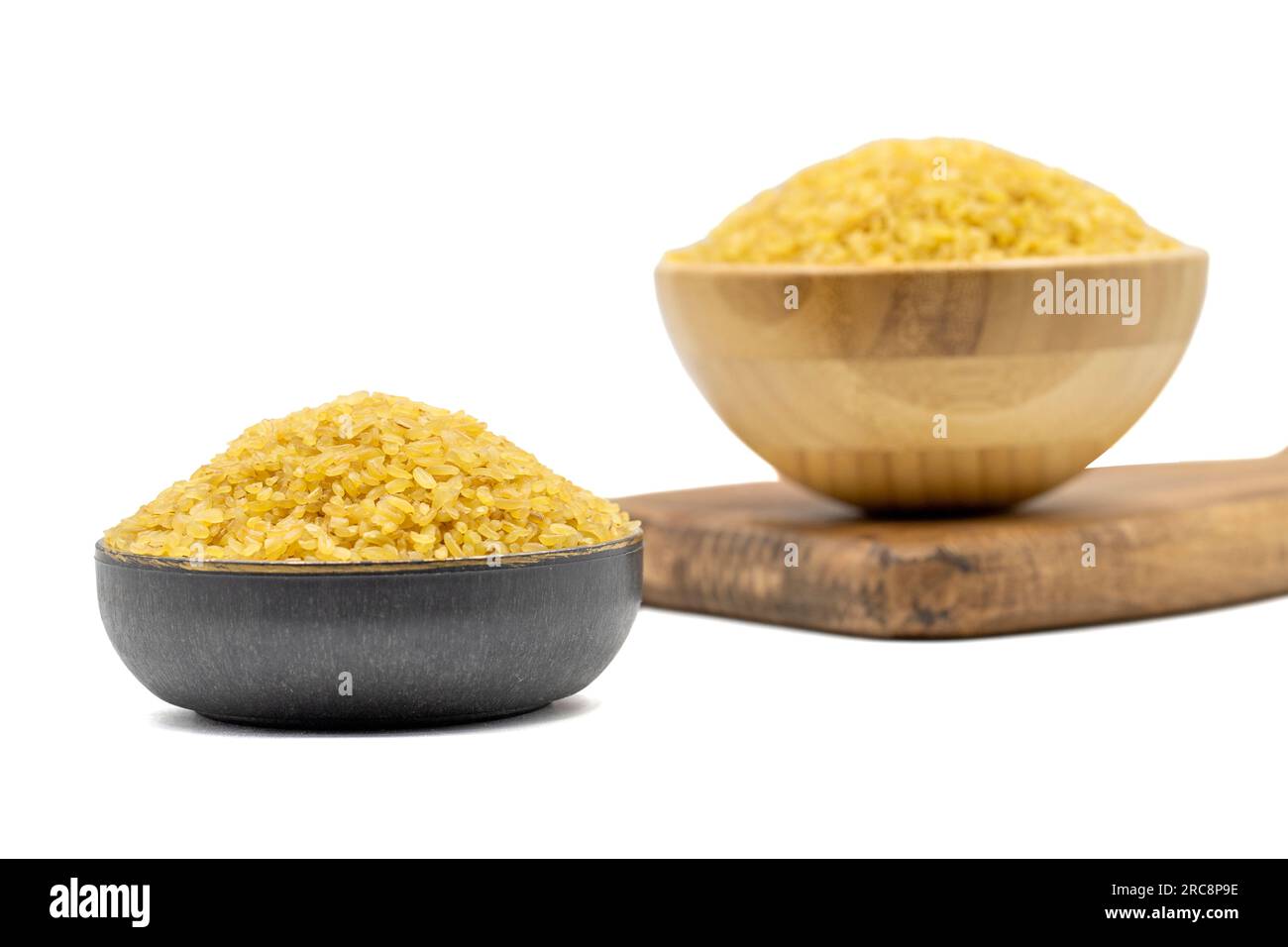 Raw bulgur wheat isolated on white background. Uncooked dried bulgur in ...