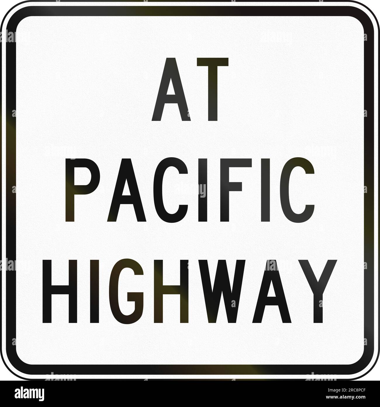 Supplementary Australian road sign: At Pacific Highway Stock Photo - Alamy