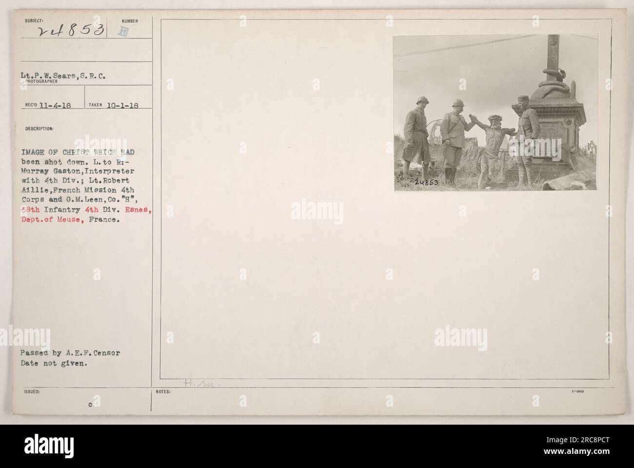 Title: Lt. P.W. Sears and Soldiers Examining Shot Down Image of Christ Caption: Lt. P.W. Sears ...