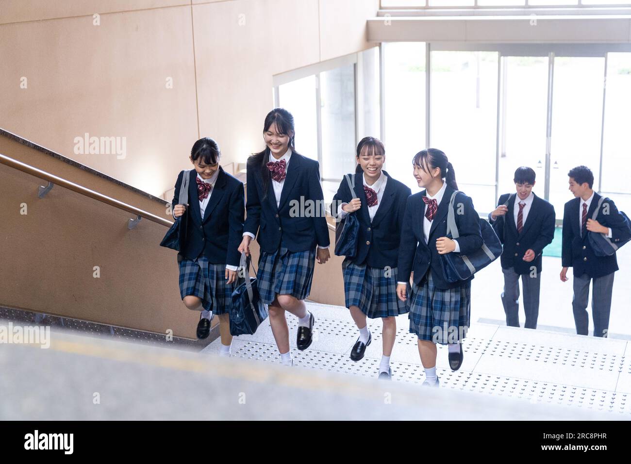Group of people climbing stairs hi-res stock photography and images - Alamy