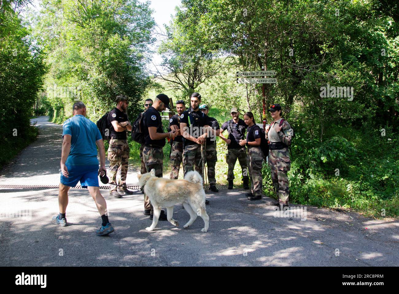Vernet, France. 13th July, 2023. A walker passes in front of gendarmes ...