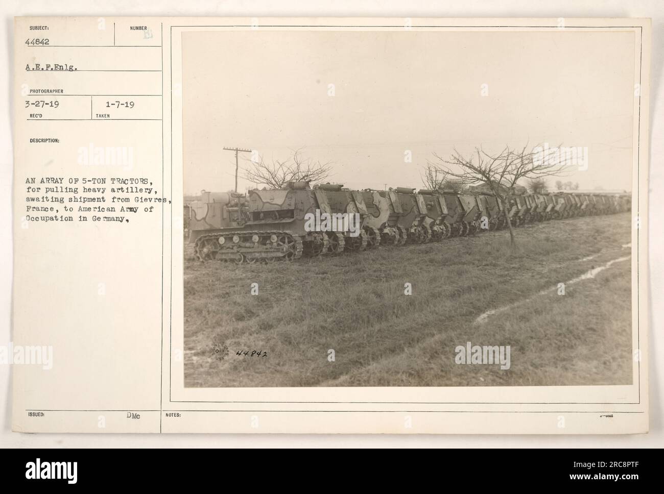 An array of 5-ton tractors used for pulling heavy artillery awaits ...