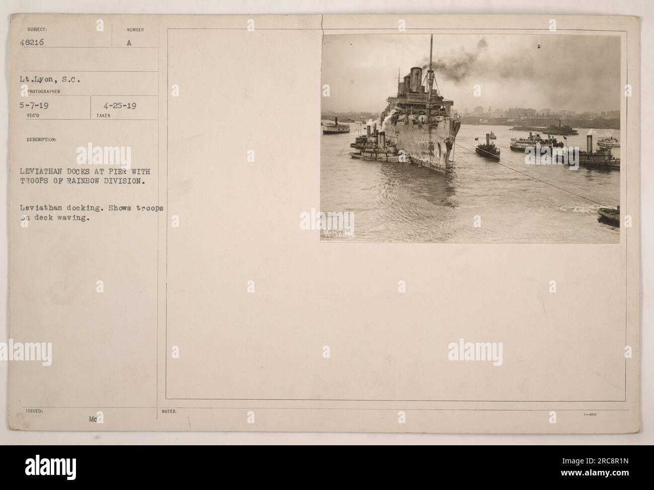 "Leviathan, a military transport ship, docks at a pier with troops from ...