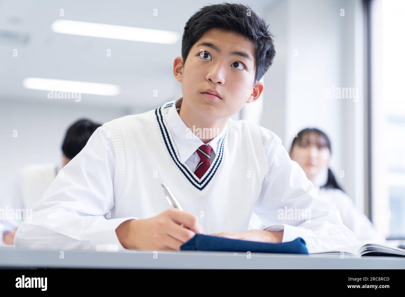 Students taking exam uniform hi-res stock photography and images - Alamy