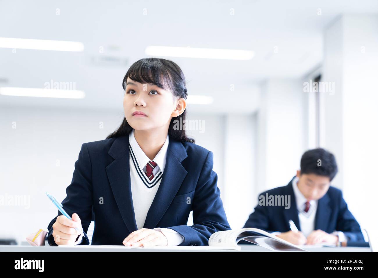 Students taking exam uniform hi-res stock photography and images - Alamy