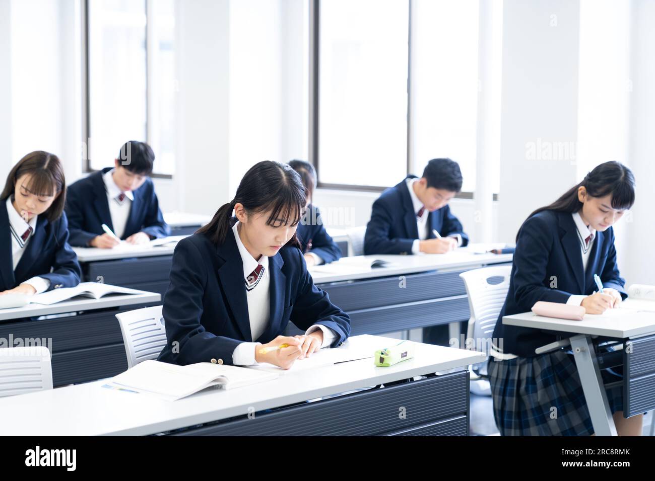 Students taking exam uniform hi-res stock photography and images - Alamy