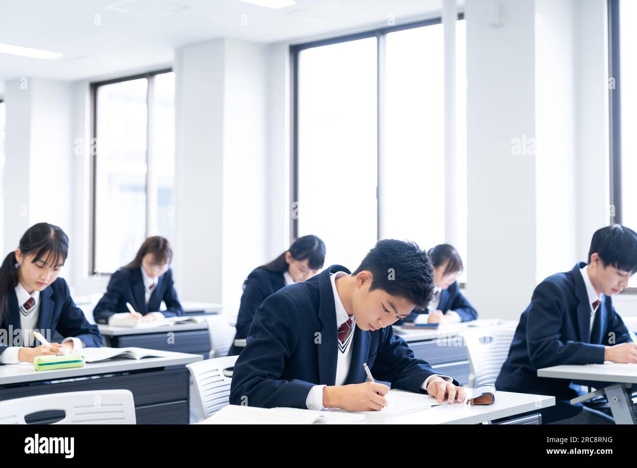 Students taking exam uniform hi-res stock photography and images - Alamy