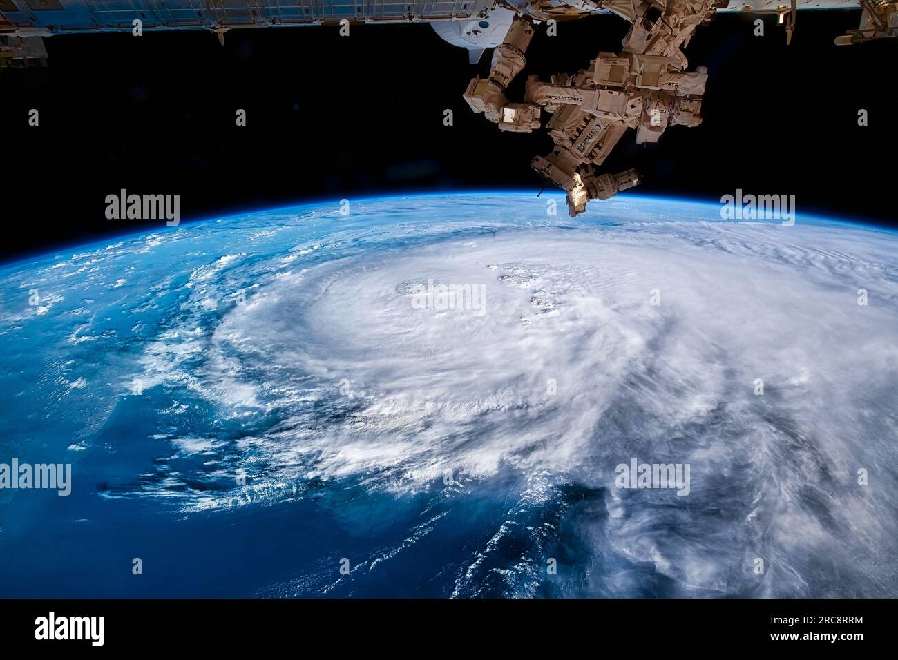 A tropical storm in the Arabian Sea is framed with ISS spaceship. Image ...
