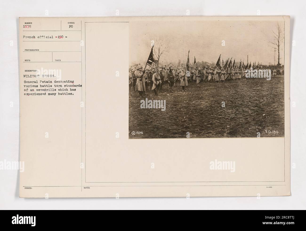 General Petain honoring an escadrille with battle-torn standards. The ...