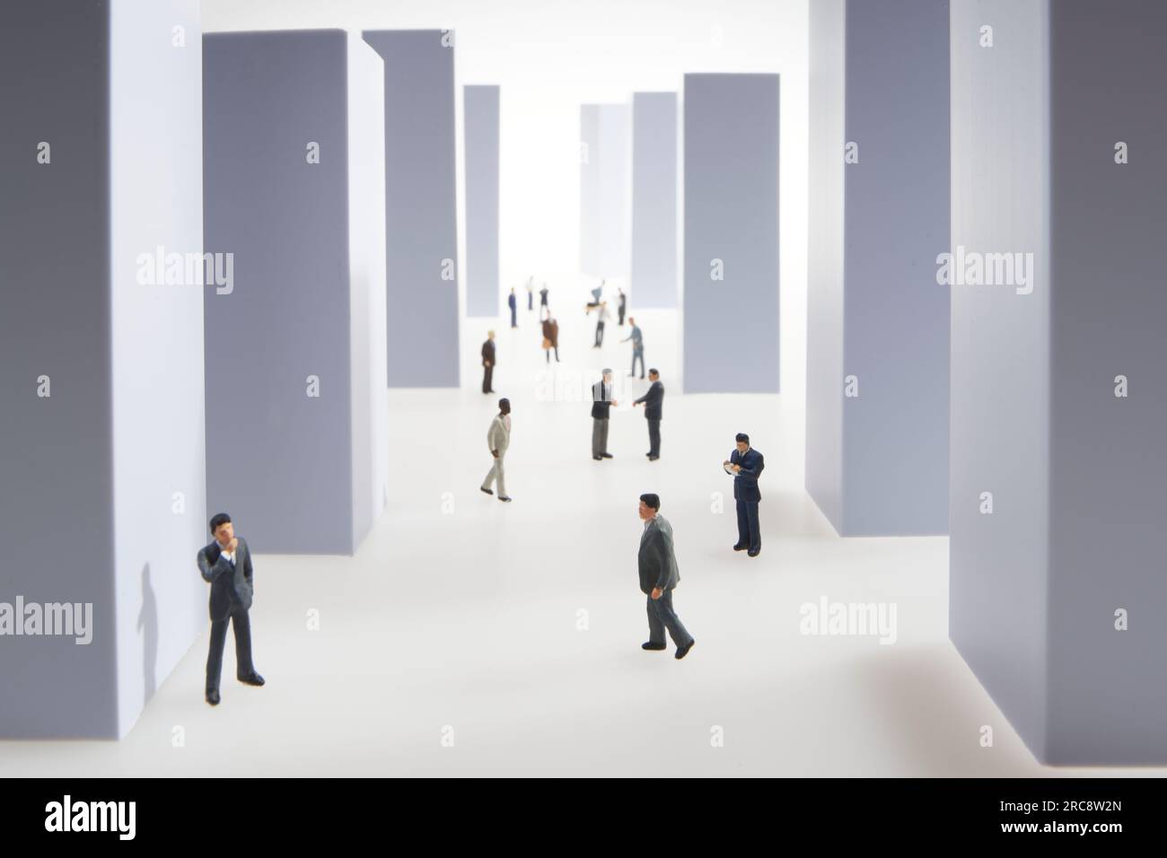 Group of buildings and miniature office workers Stock Photo - Alamy