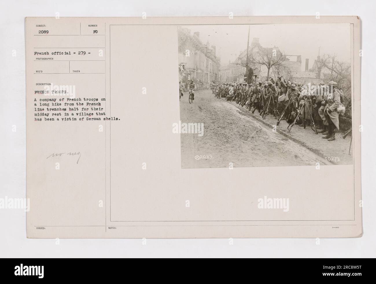 French troops take a break during their long hike from the rear to the ...