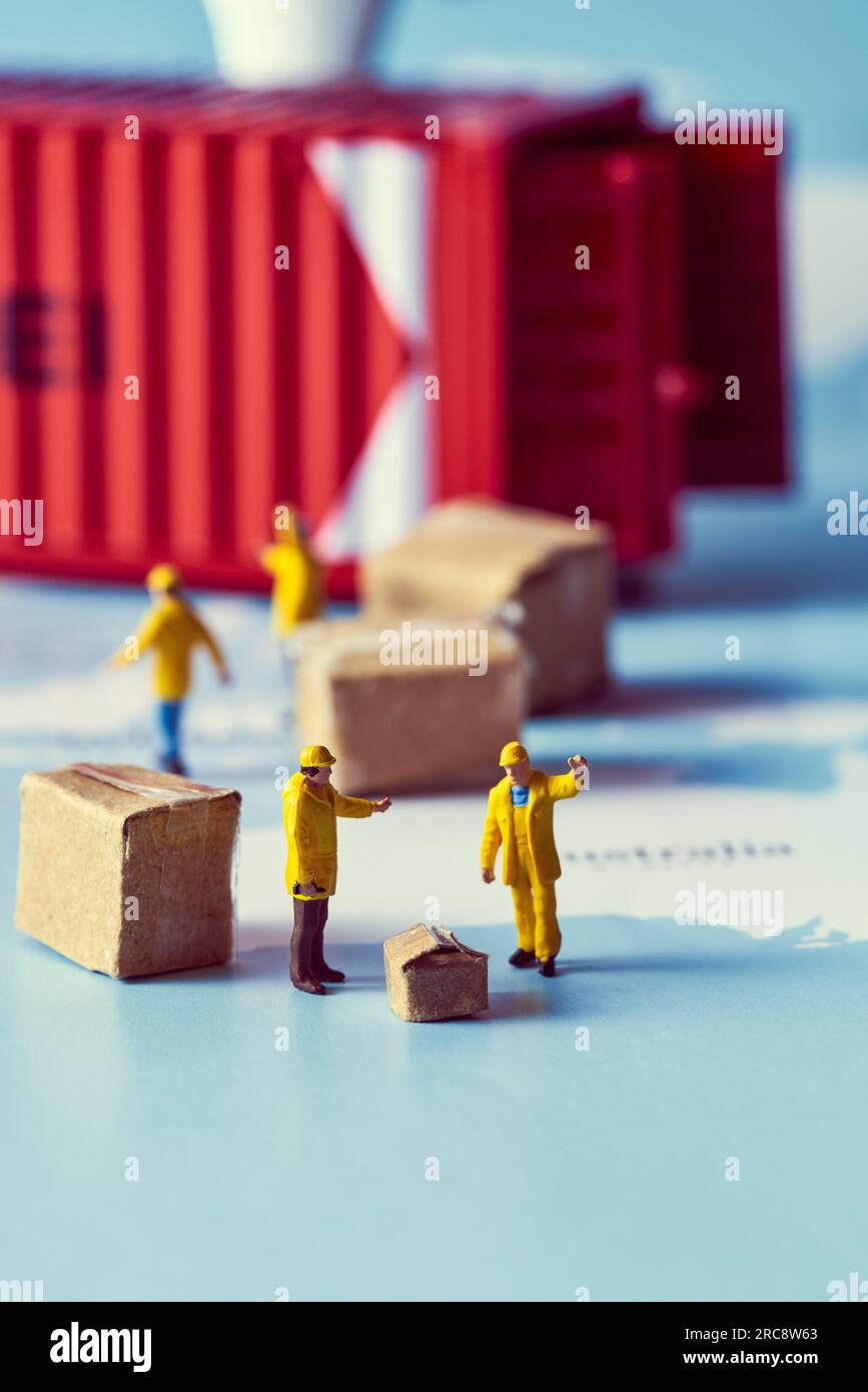 Miniature people and container carrying cardboard boxes Stock Photo - Alamy