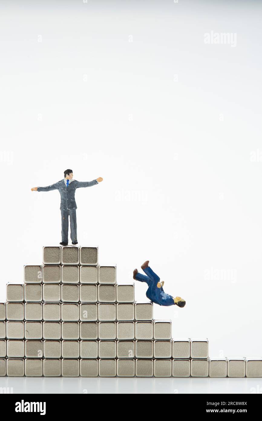 Miniature doll with magnetic cube Stock Photo - Alamy