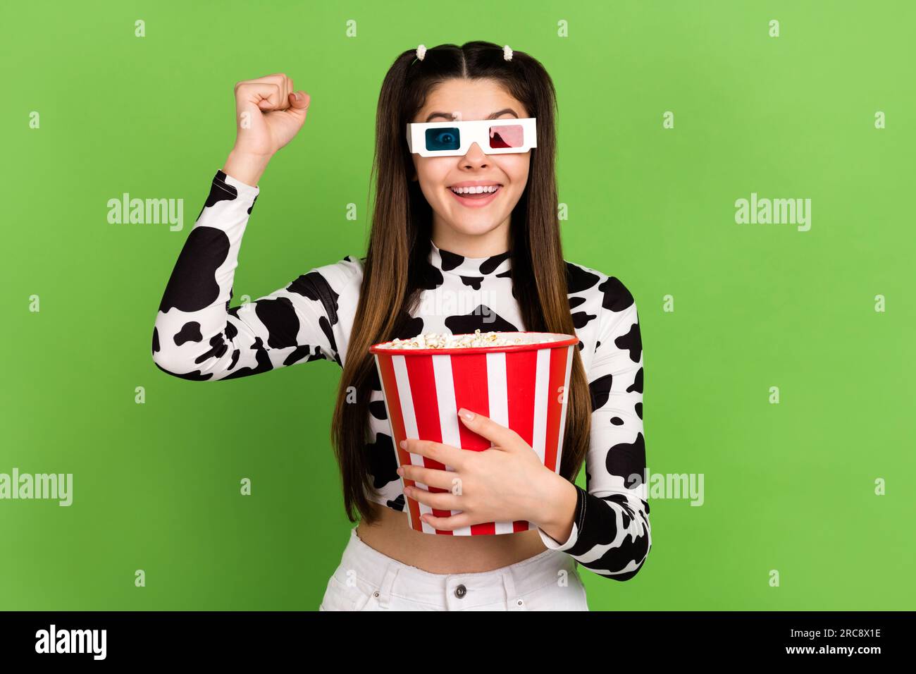 Photo of lucky excited girl dressed cowskin top 3d eyewear rising fist ...