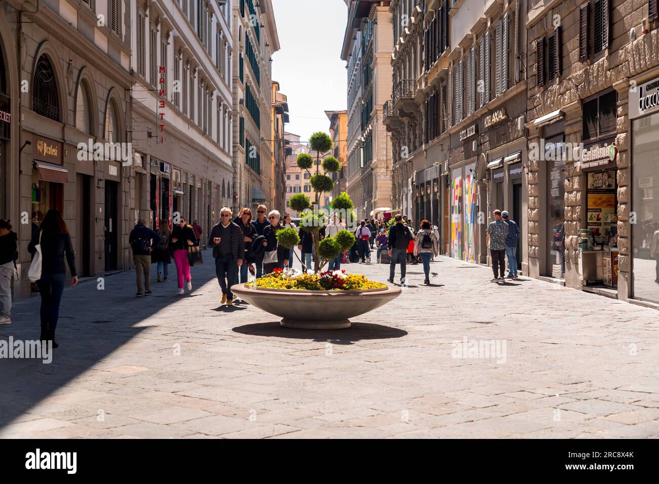 Florence, Italy - April 5, 2022: People walking through the Via dei ...