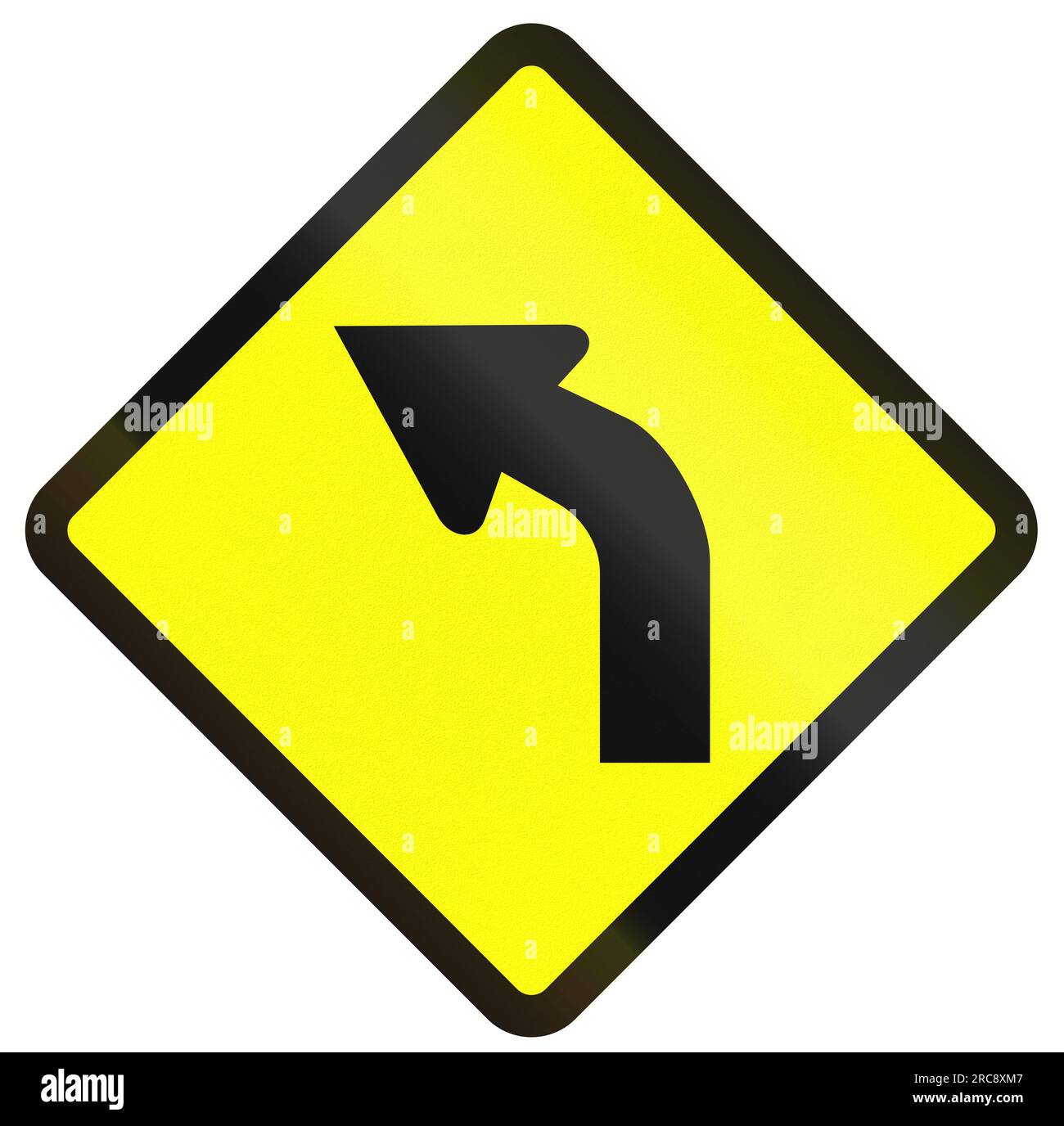 Indonesian road warning sign: Left curve ahead Stock Photo - Alamy