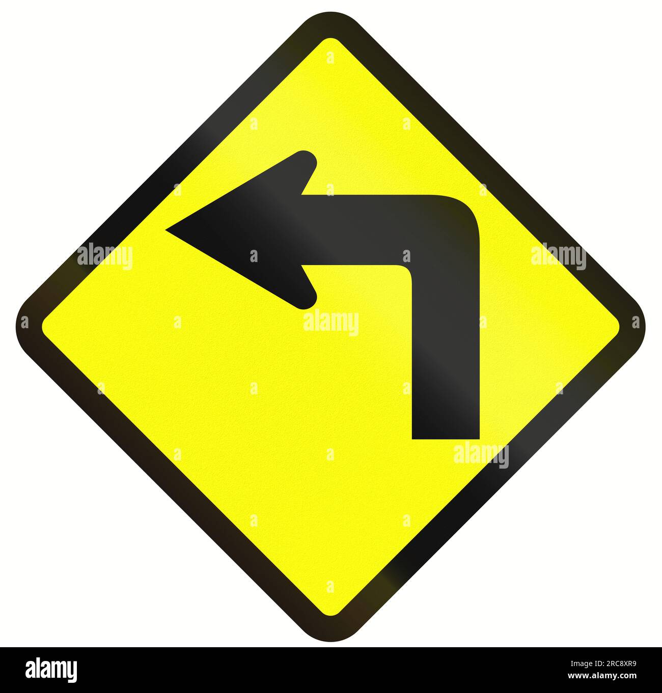 Indonesian road warning sign: Left curve ahead Stock Photo - Alamy