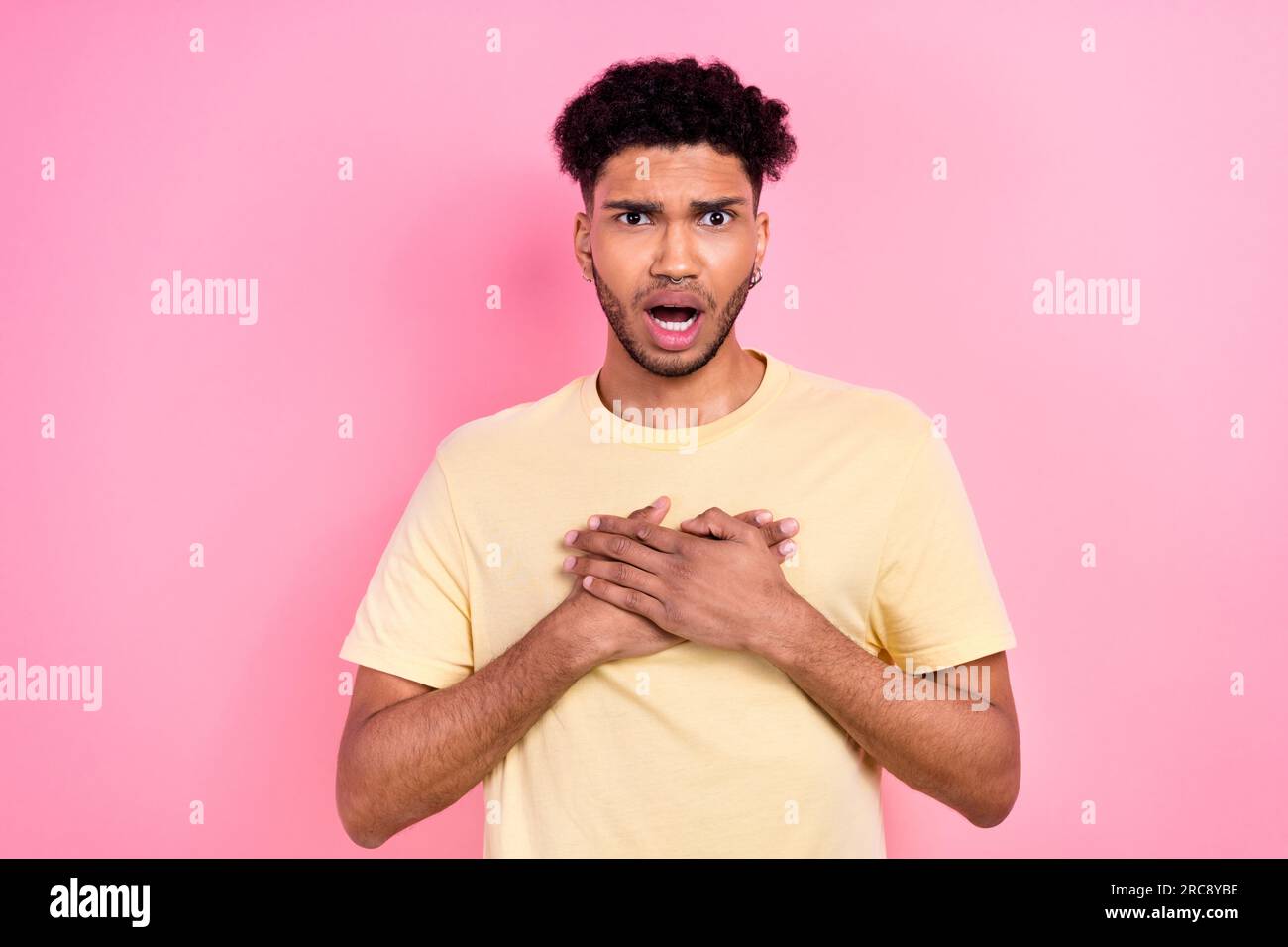 Photo of offended confused upset guy with afro hairstyle dressed yellow ...