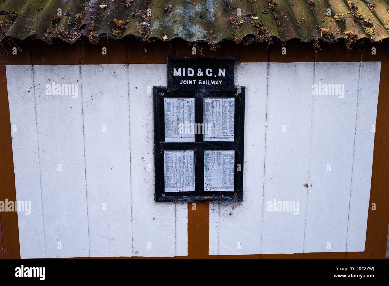 Rail time table and travel posters at the disused Honing railway ...