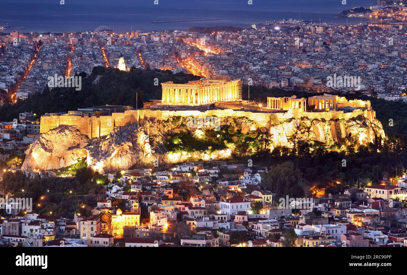 Cityscape of Athens with illuminated Acropolis hill, Pathenon and sea ...