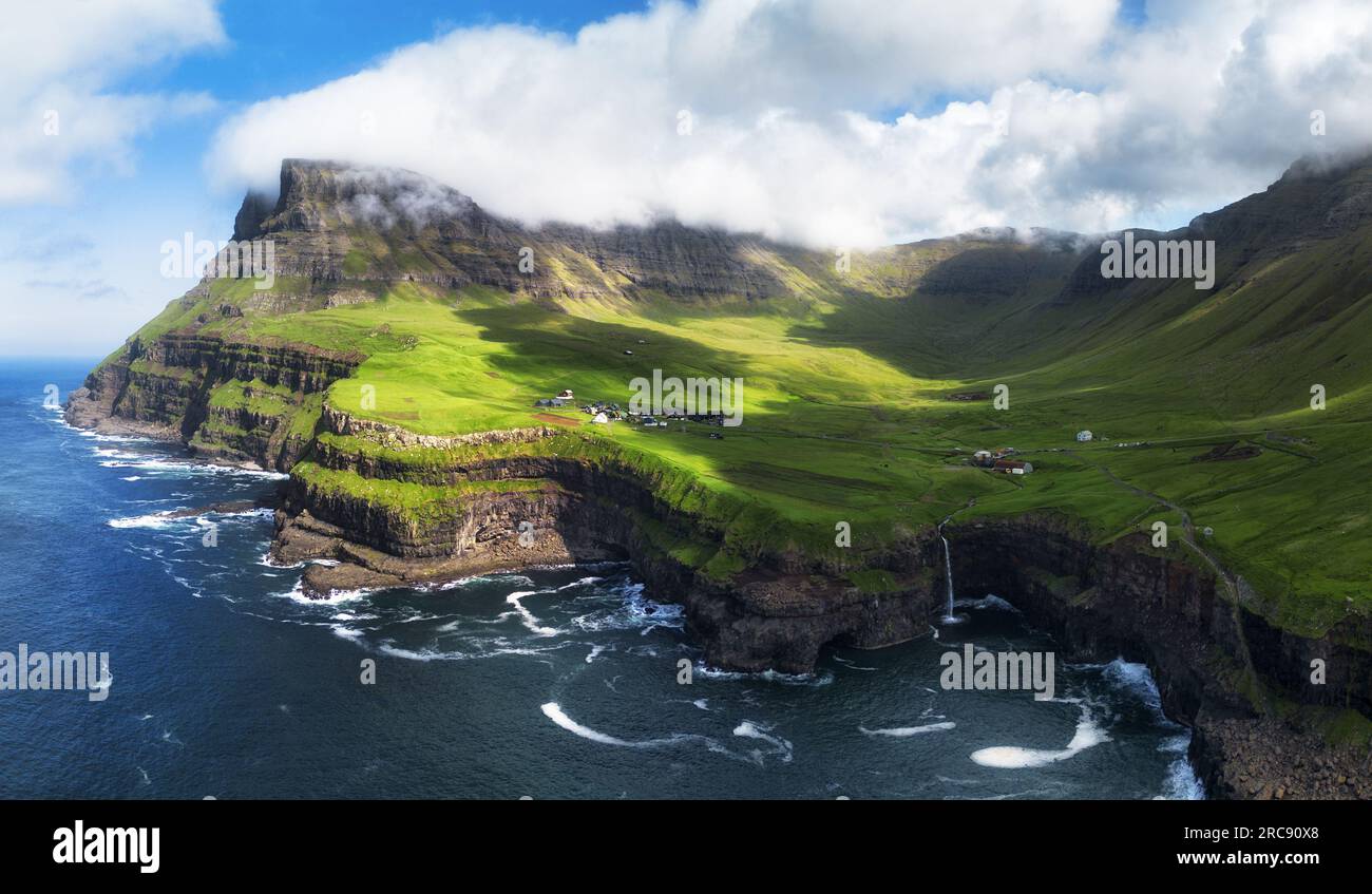 View from flying drone. Majestic morning scene of Mulafossur Waterfall ...