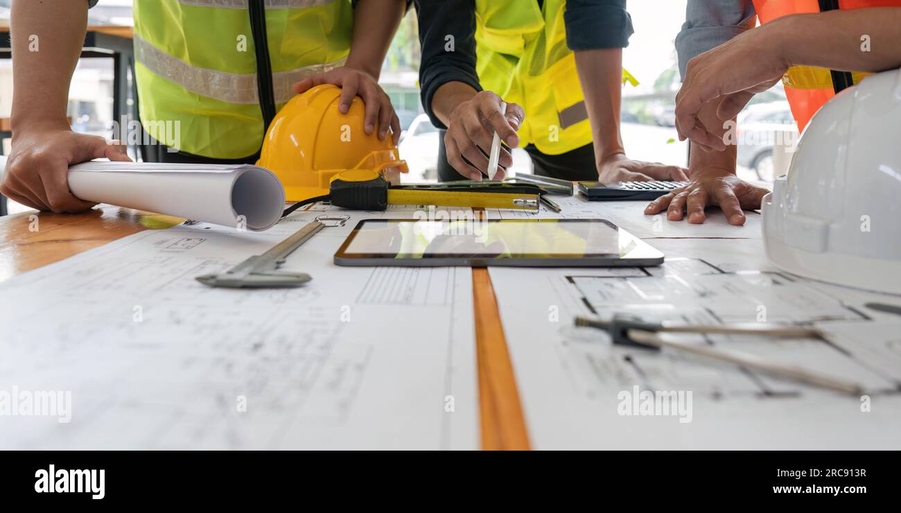 engineer team working in office with blueprints, inspection in ...
