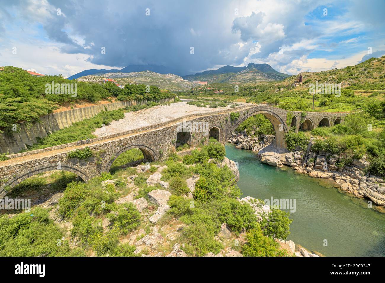 Drone view of the Mesi Bridge, located in Albania, is an architectural ...