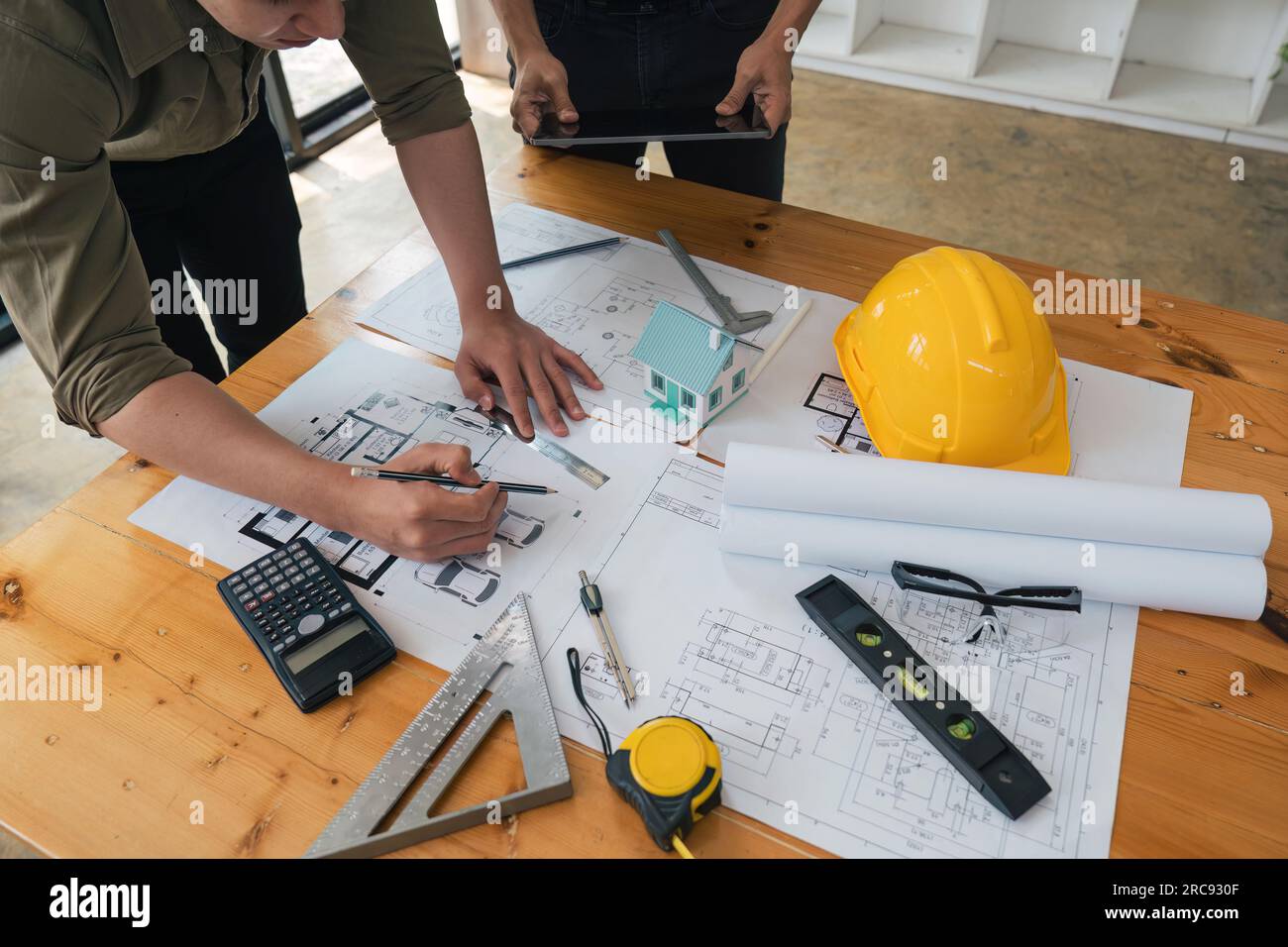 engineer team working in office with blueprints, inspection in ...