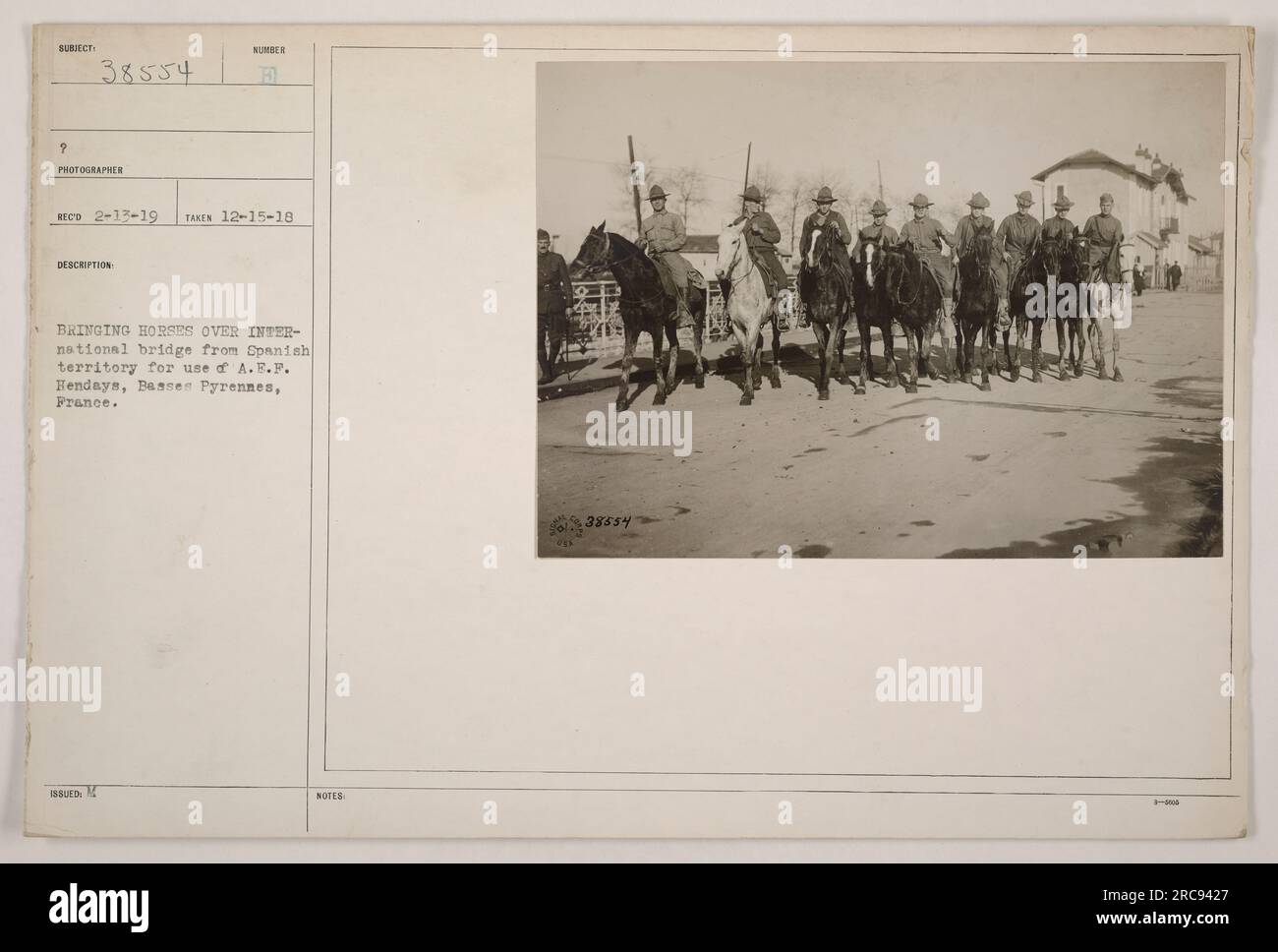 American military personnel bring horses over an international bridge ...