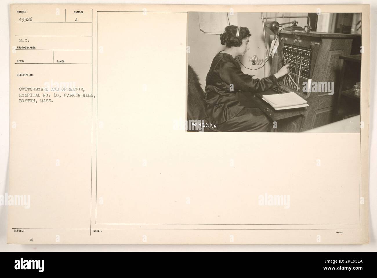 A photograph of a switchboard and operator at Hospital No. 10 in Parker ...