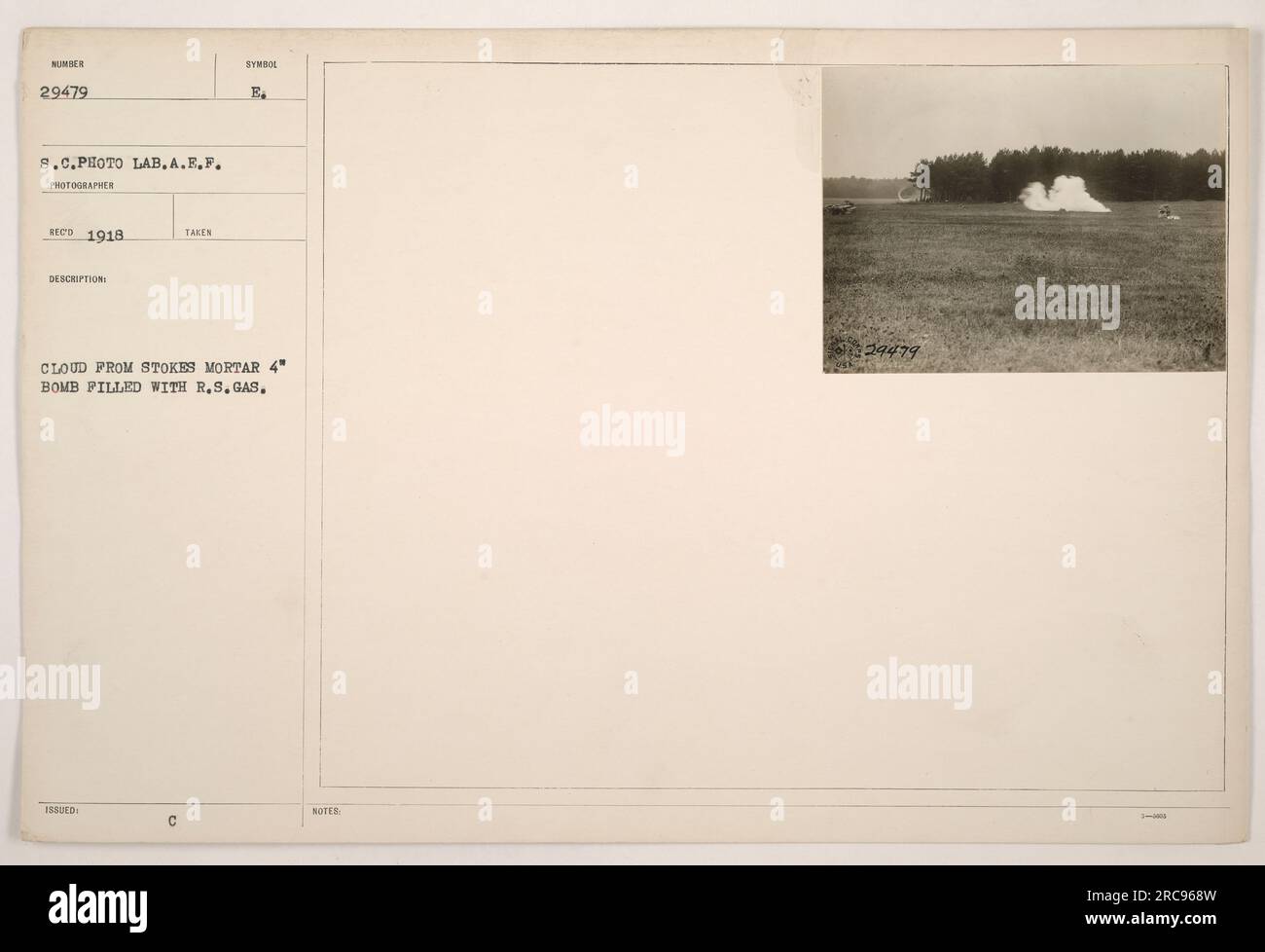 American soldier launching a Stokes mortar 4" bomb filled with R.S. gas ...