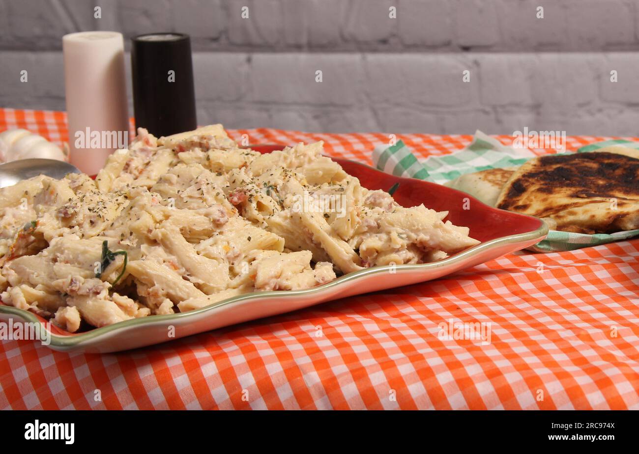 Pasta Carbonara With Italian Flat Bread on Rustic Buffet Table Stock ...