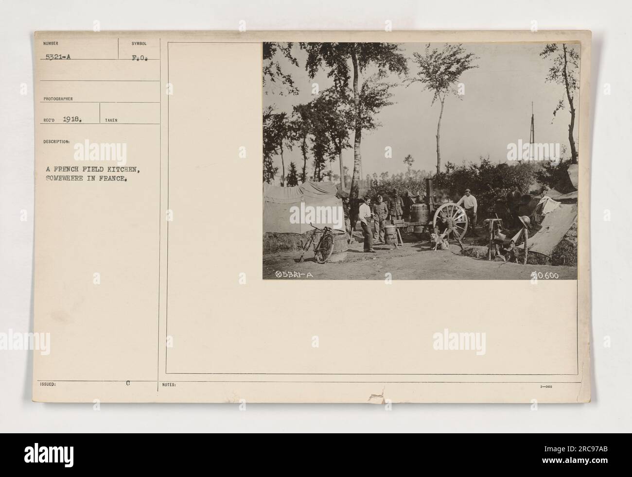 US soldiers gather around a French field kitchen during World War One ...