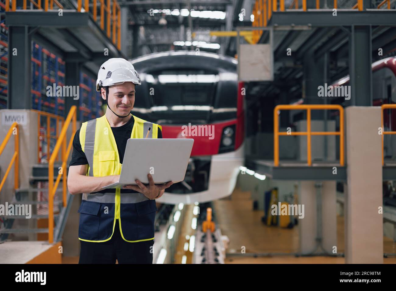 Technician Engineer maintenance service electric train with laptop ...