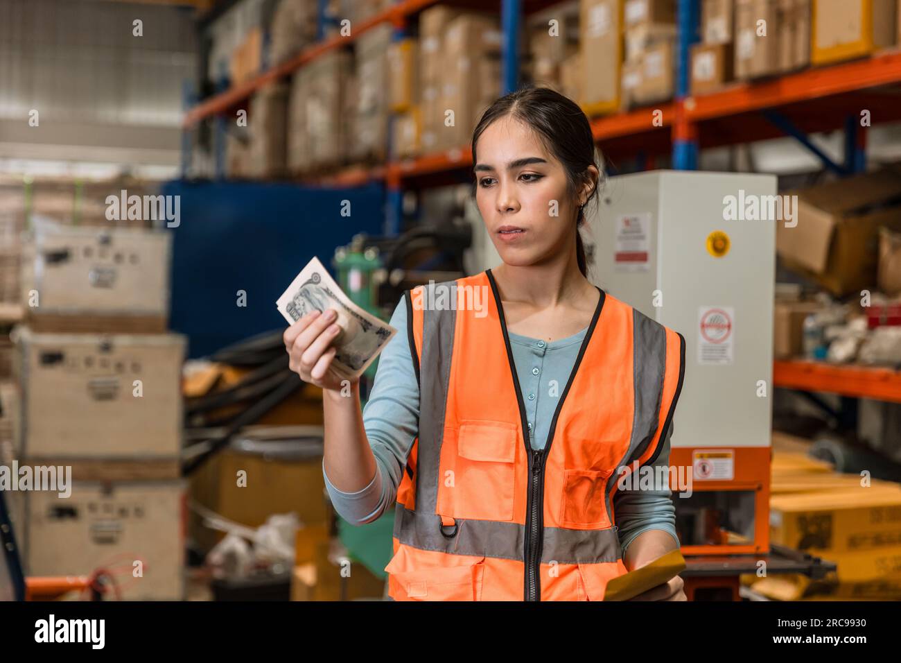 Warehouse factory engineer woman worker receive low cut salary decrease ...