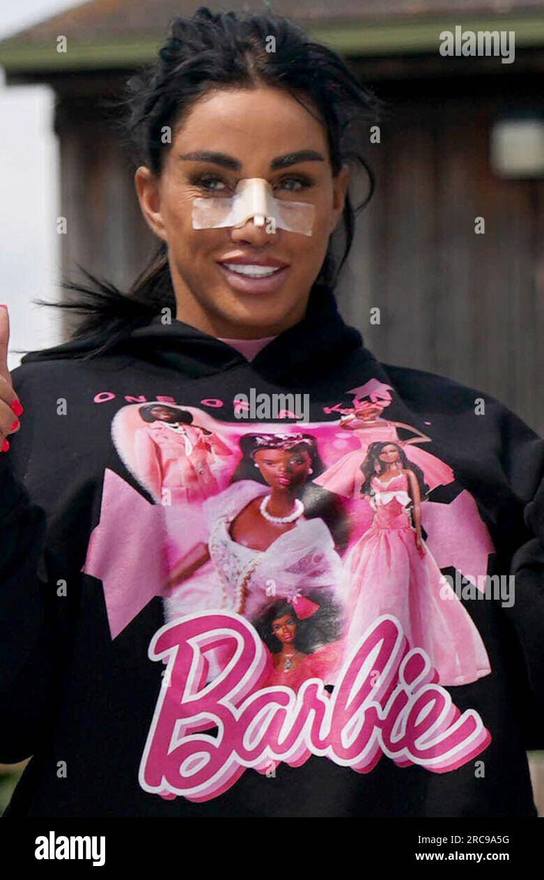 Katie Price and her son Harvey stand by his drawing, after he was ...