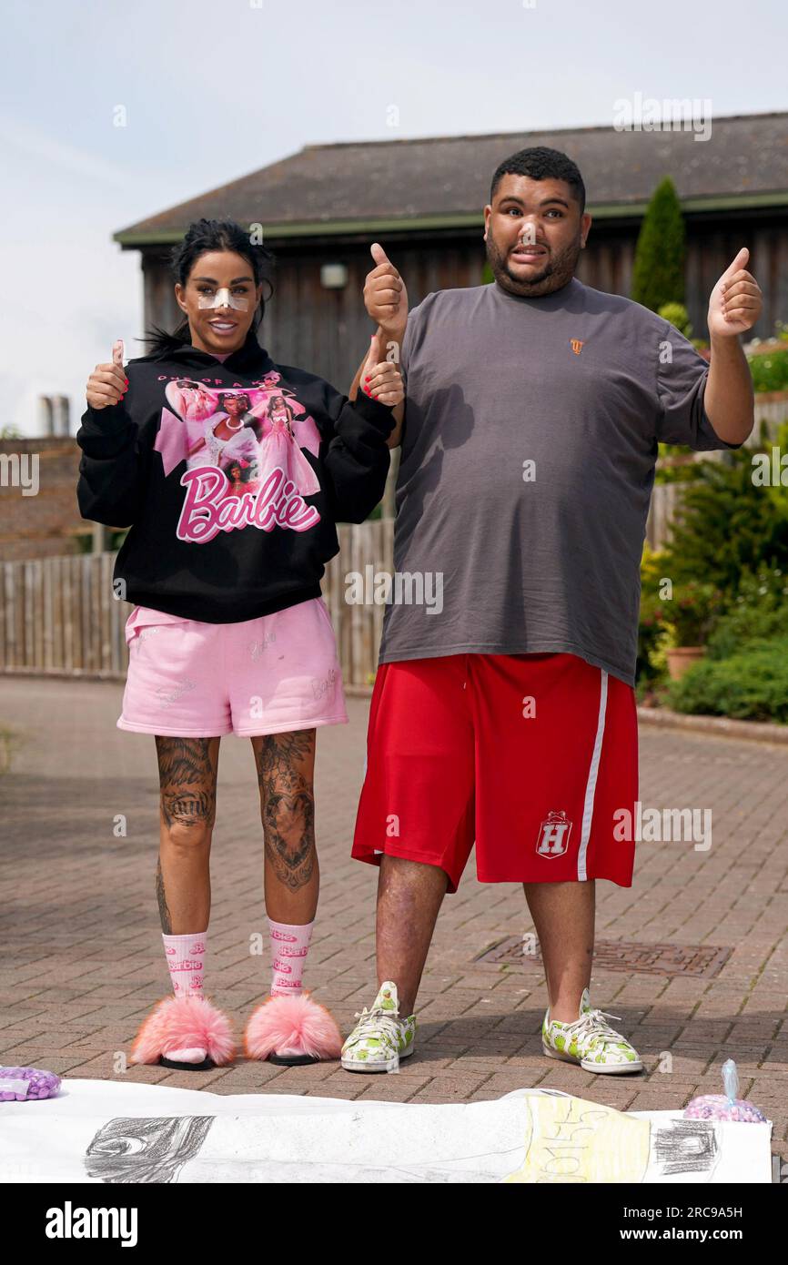 Katie Price and her son Harvey stand by his drawing, after he was ...