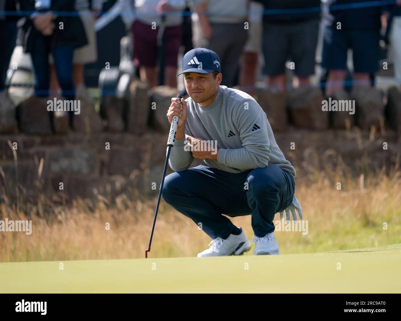North Berwick, East Lothian, Scotland, UK. 13th July 2023. Xander Schauffele lines up putt on ...