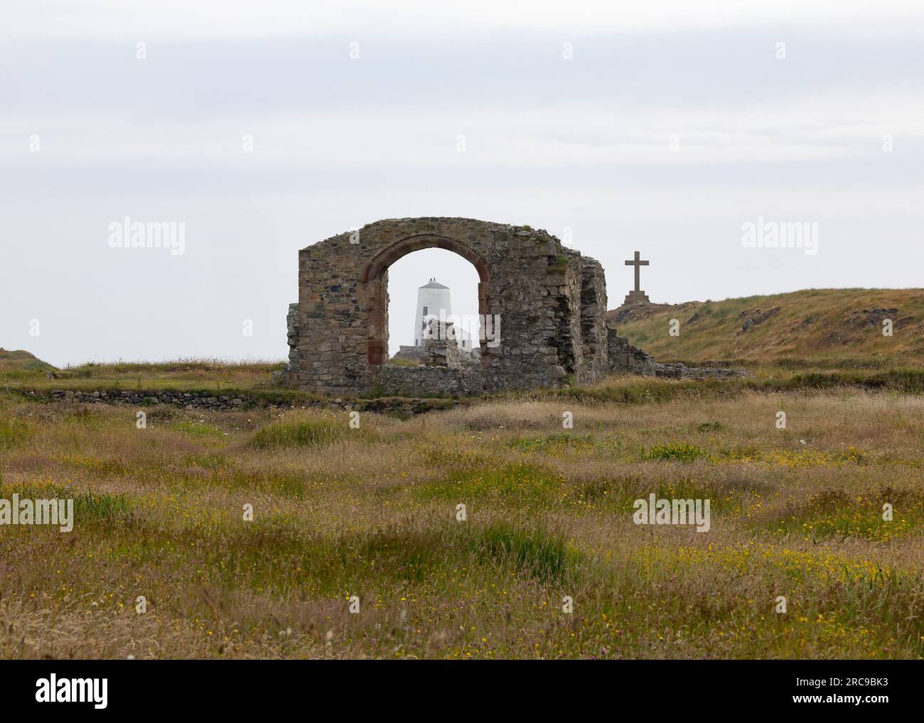 Tyn Mawr lighthouse seen through the ruined remains of St Dwynwen's ...
